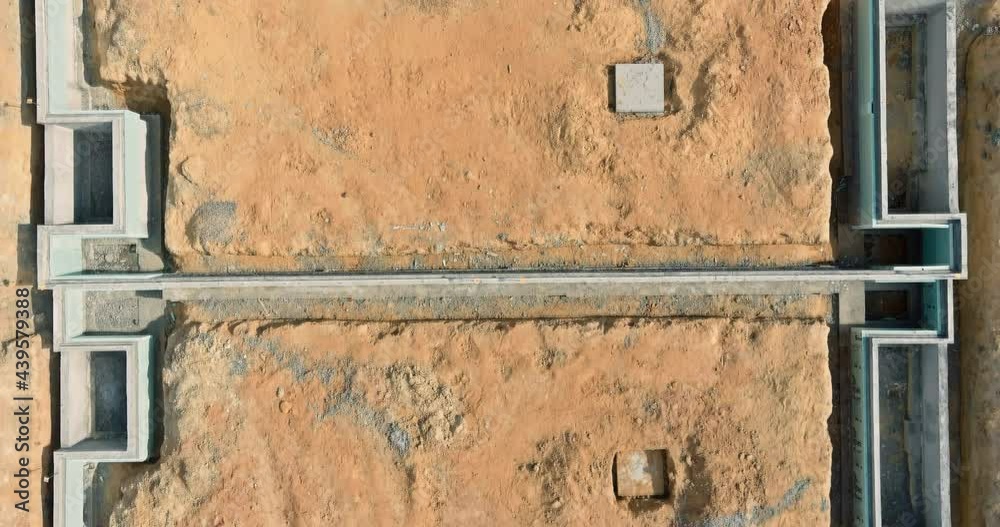 Building construction real property of trenches dug in ground and ...