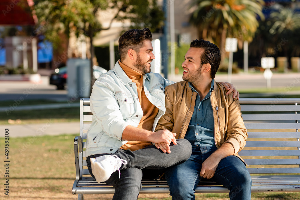 Happy Gay Couple Laughs Together While Sharing A Tender Moment At The happy-gay-couple-laughs-together-while-sharing-a-tender-moment-at-the