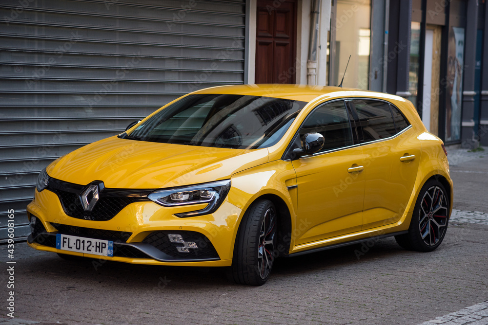 Mulhouse - France - 15 June 2021 - Front view of yellow Renault megane ...