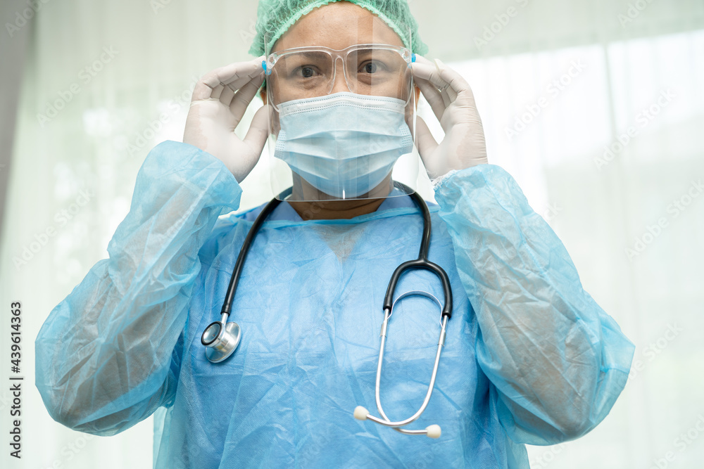 Asian doctor wearing face shield and PPE suit new normal to check ...