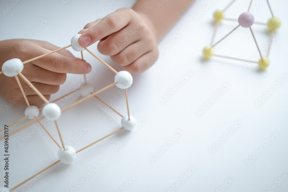 STEM education, Child learning making 3D geometric shapes, Building ...