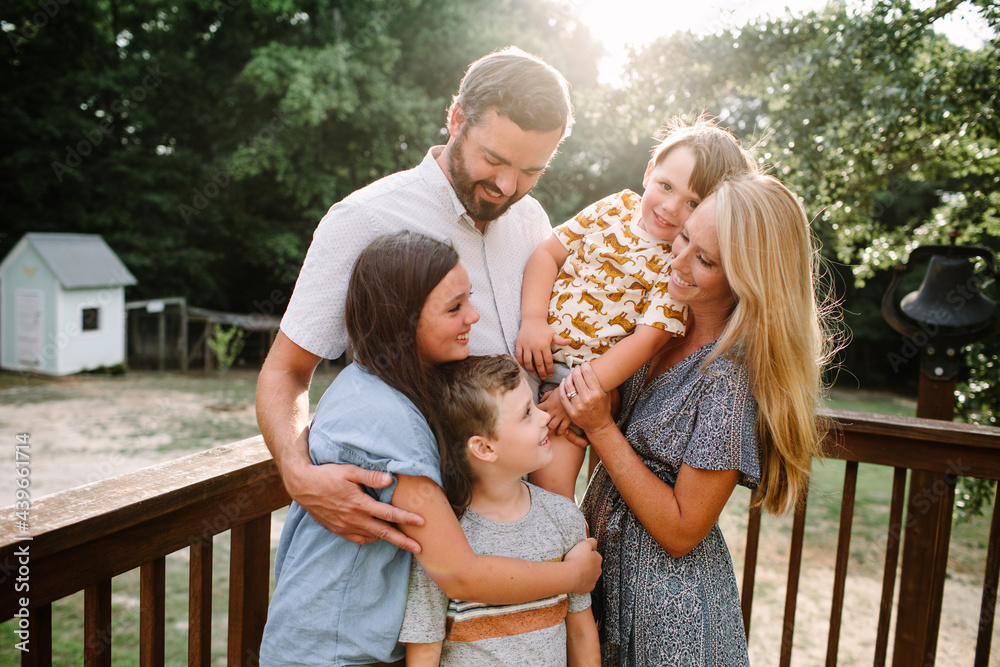 Family Standing on Porch Together Stock Photo | Adobe Stock