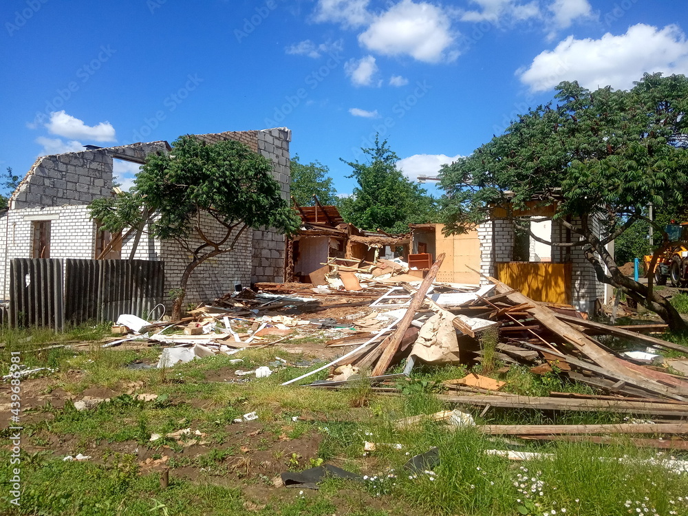 wreckage of an old destroyed wooden house, demolition of a private ...