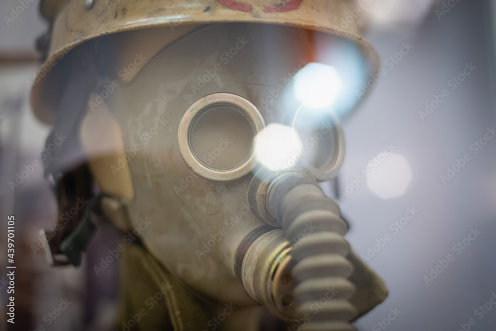 The old uniform of a fireman in a gas mask. Stock 写真 | Adobe Stock