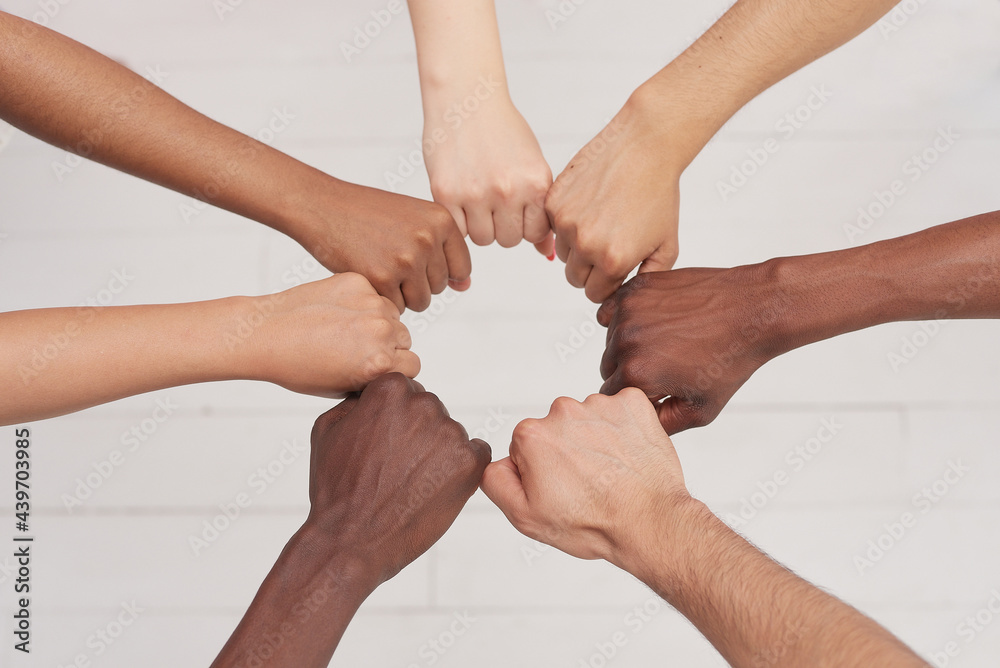 Multiethnic people holding hands in a circle together, multiethnic ... Multiethnic people holding hands in a circle together, multiethnic ...