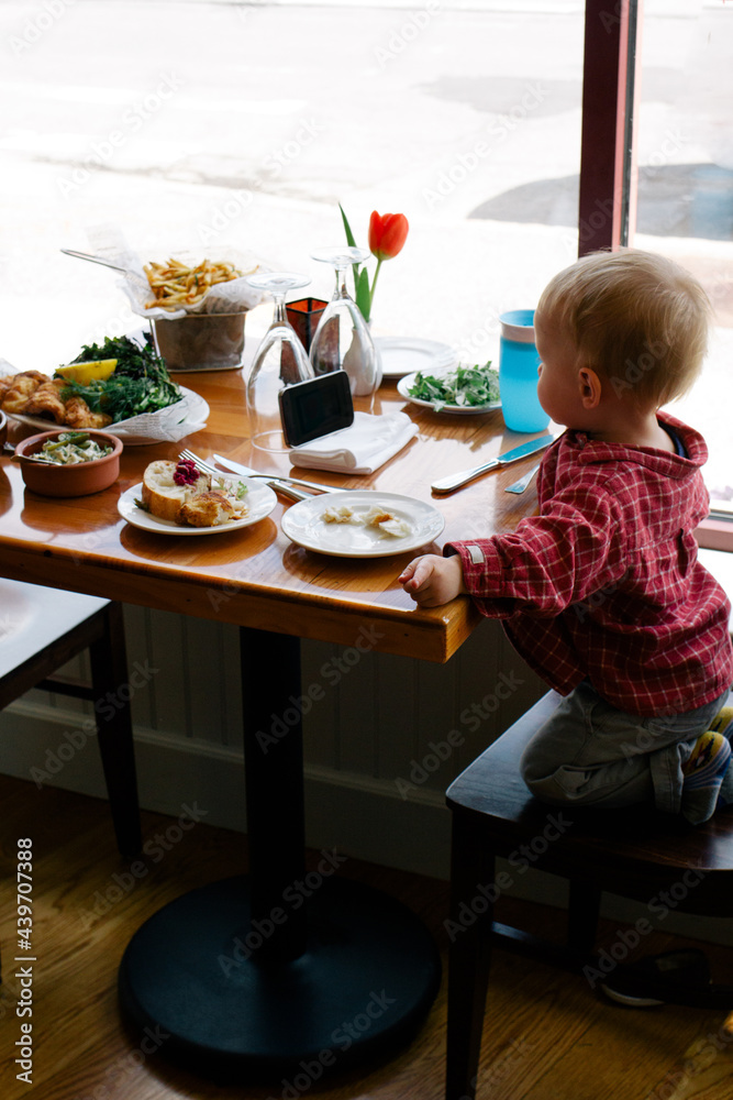 Little bot at the restaurant Stock Photo | Adobe Stock