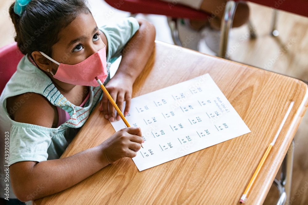 School: Girl Student With Face Mask Looks Up While Thinking Stock Photo ...