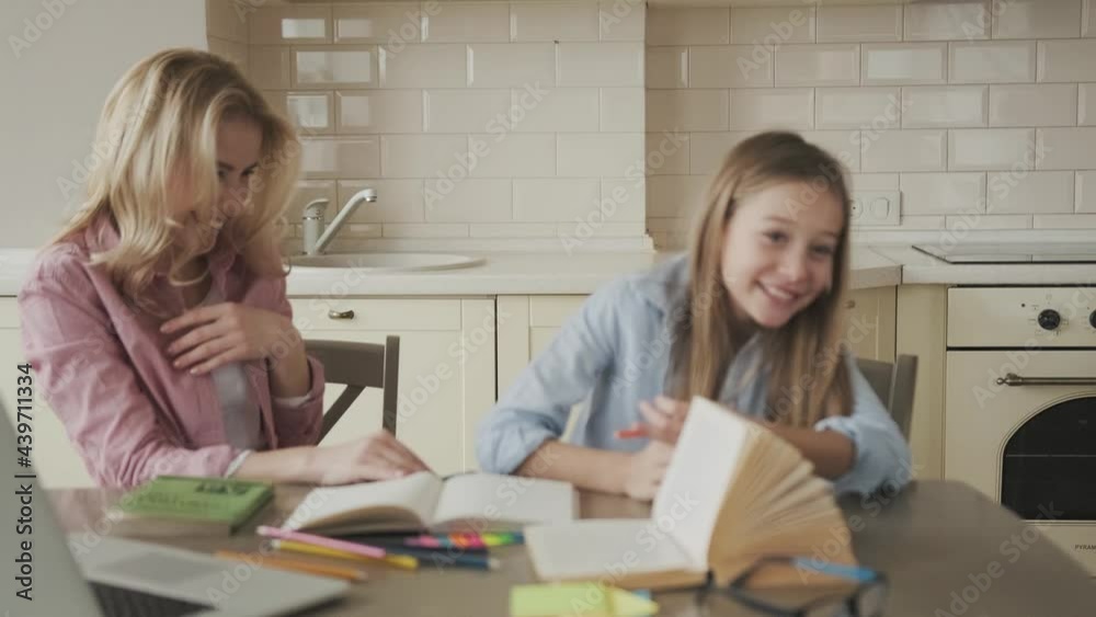 Mom Helps Her Daughter Do Her Homework They Are Having Fun Together