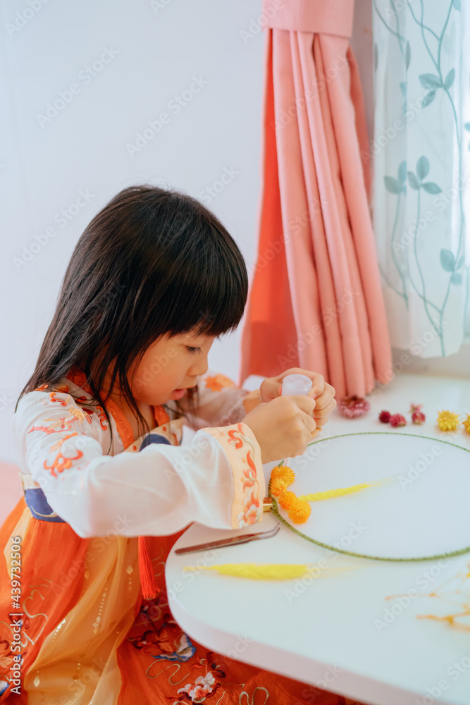 Asian kid making dried flower fan decoration DIY Stock Photo | Adobe Stock