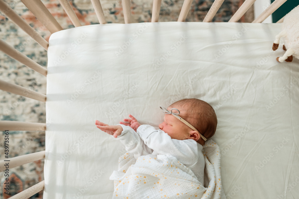 Newborn Baby Stretches Stock Photo | Adobe Stock