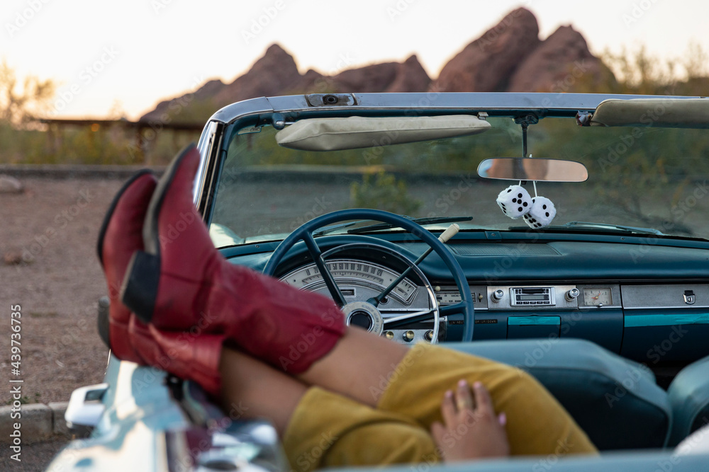 Red Cowboy boots in Backseat of Convertible car on Road Trip Stock ...