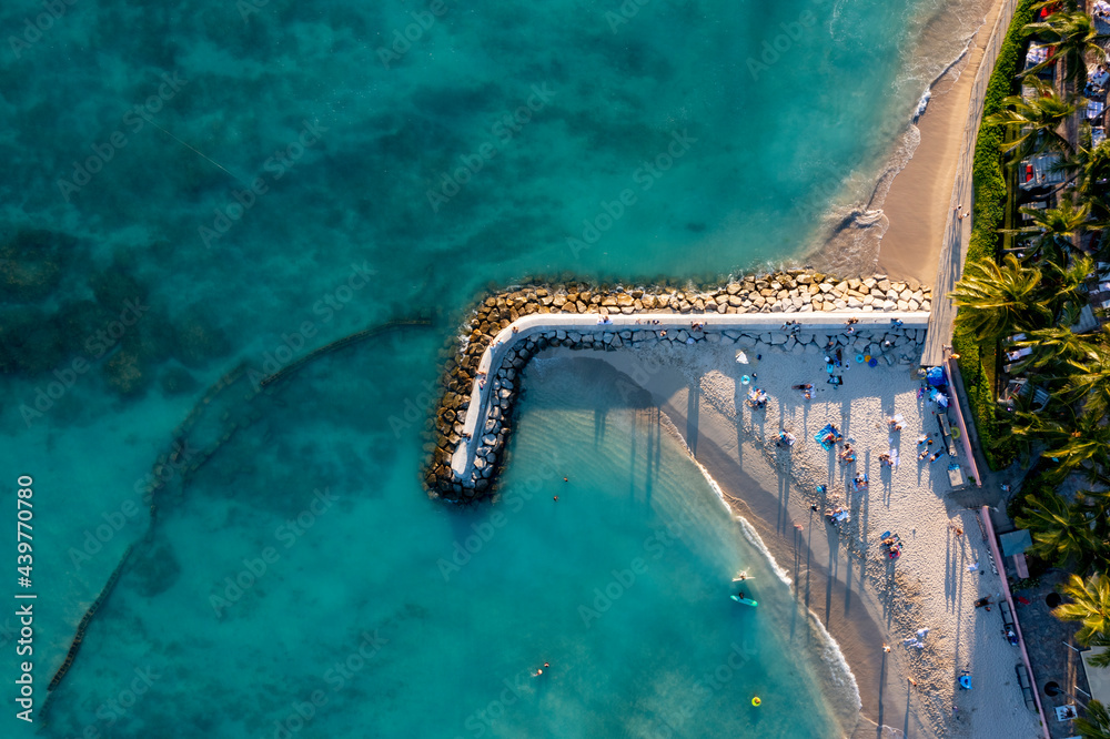 Sand groin built to prevent erosion along Waikiki Beach Stock Photo ...