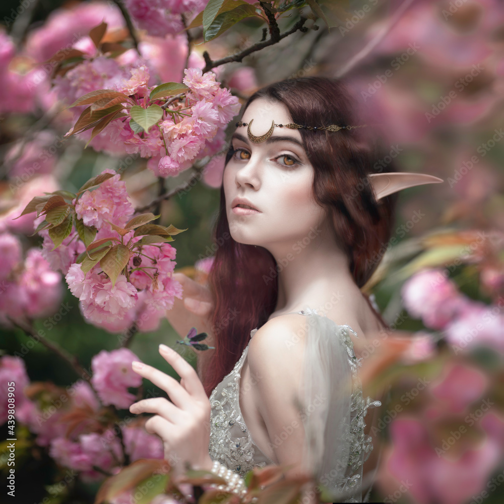 Little white-skinned nymph in pink flowers of spring sakura Stock Photo ...