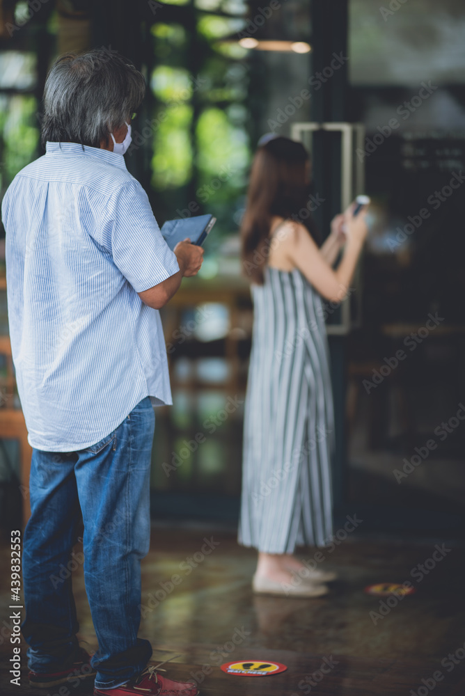 People standing in line or queue front of store due to coronavirus ...