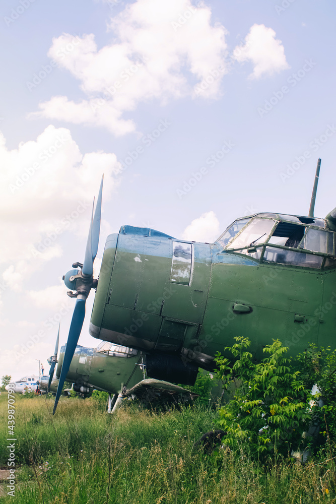 A close-up of an old aircraft engine showing rust and breakage. Visible ...