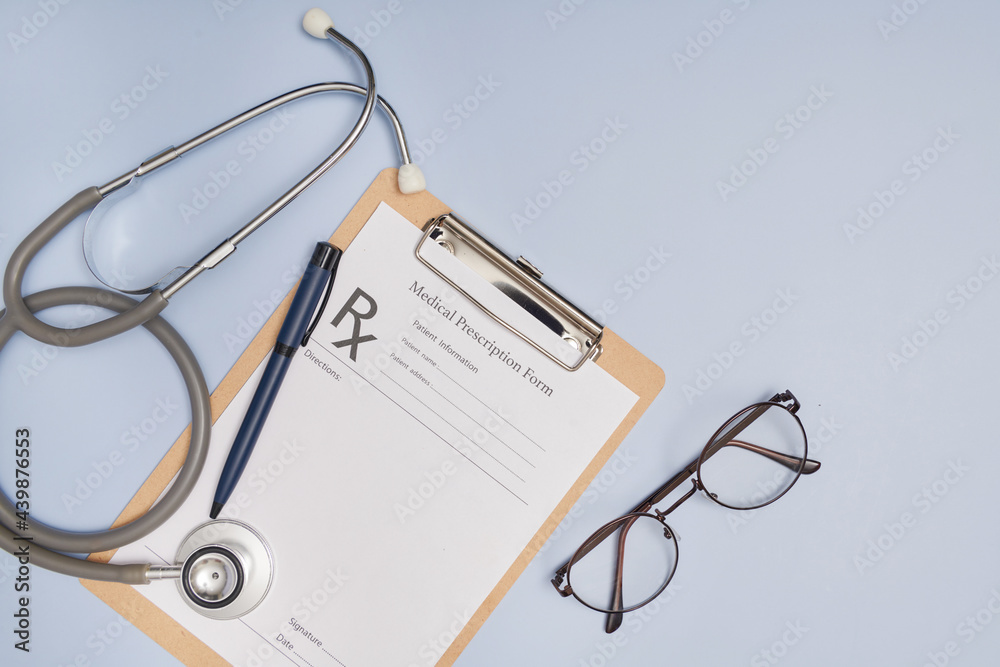 Stethoscope, a pen and a blank prescription pad. Medicine or pharmacy ...