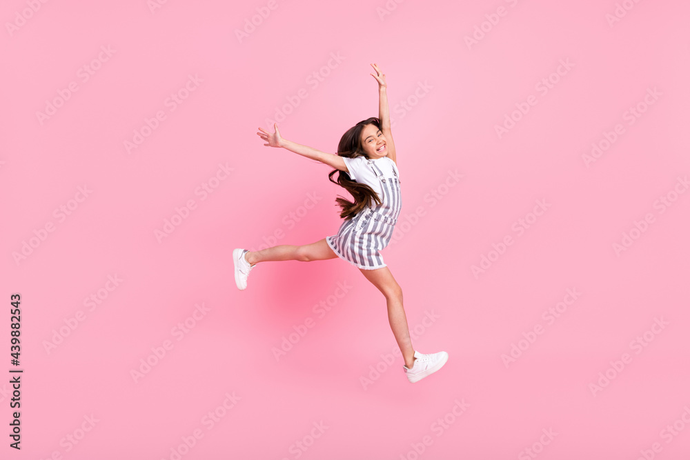 Full size profile side photo of cheerful funky happy little girl jump ...