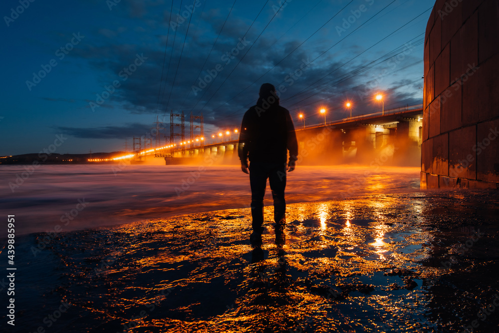 translucent Man's silhouette by a dam Stock Photo | Adobe Stock