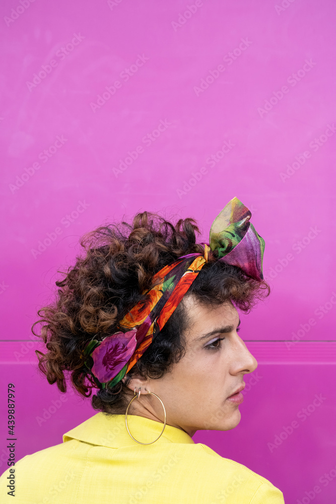 Portrait of young transgender woman on pink background Stock Photo ...
