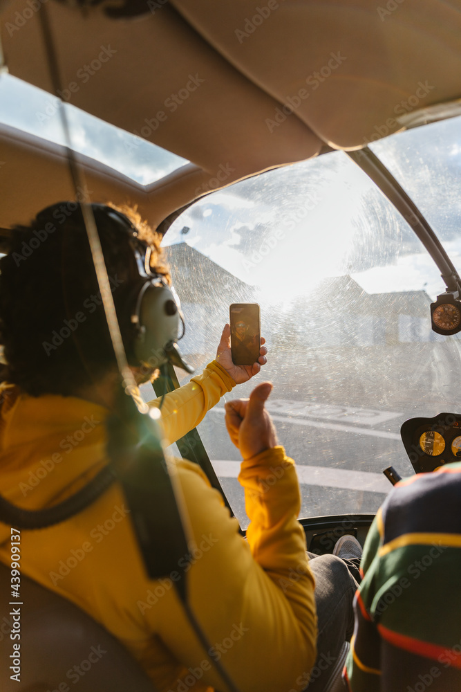 helicopter passenger taking a selfie with the phone before flying Stock ...