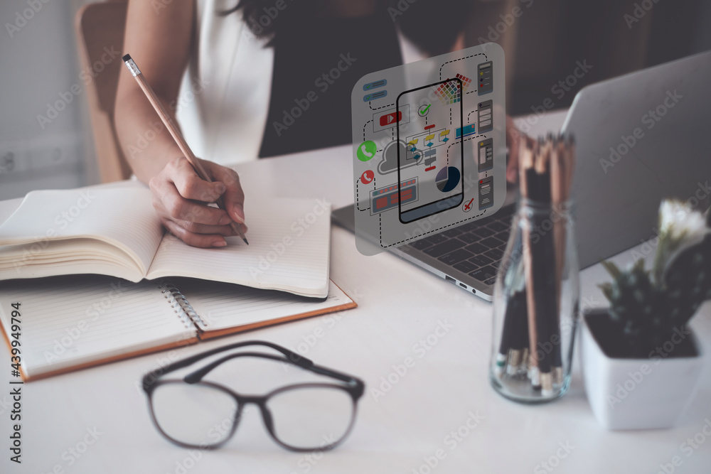 A close-up of an ux ui developer and an ui designer working on a mockup ...