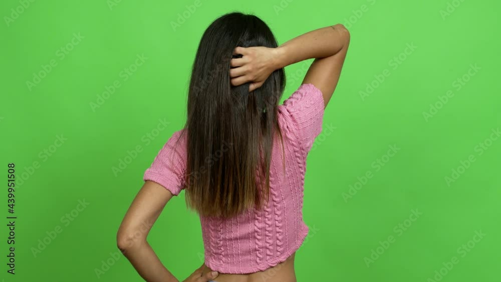 Young woman on back position looking back while scratching head over ...