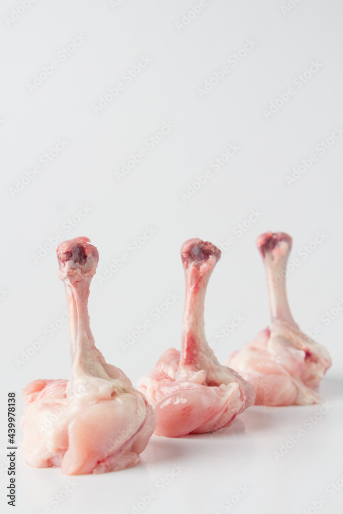 Raw chicken Lollypops, white background, isolated. Stock Photo | Adobe ...