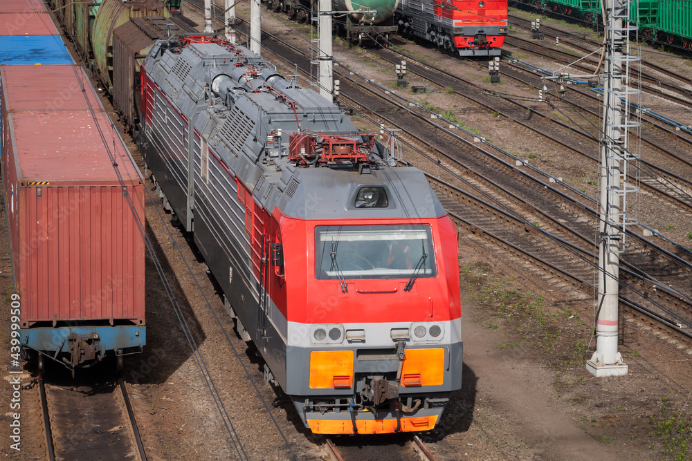 Modern red diesel electric locomotive is on a railway Stock Photo ...