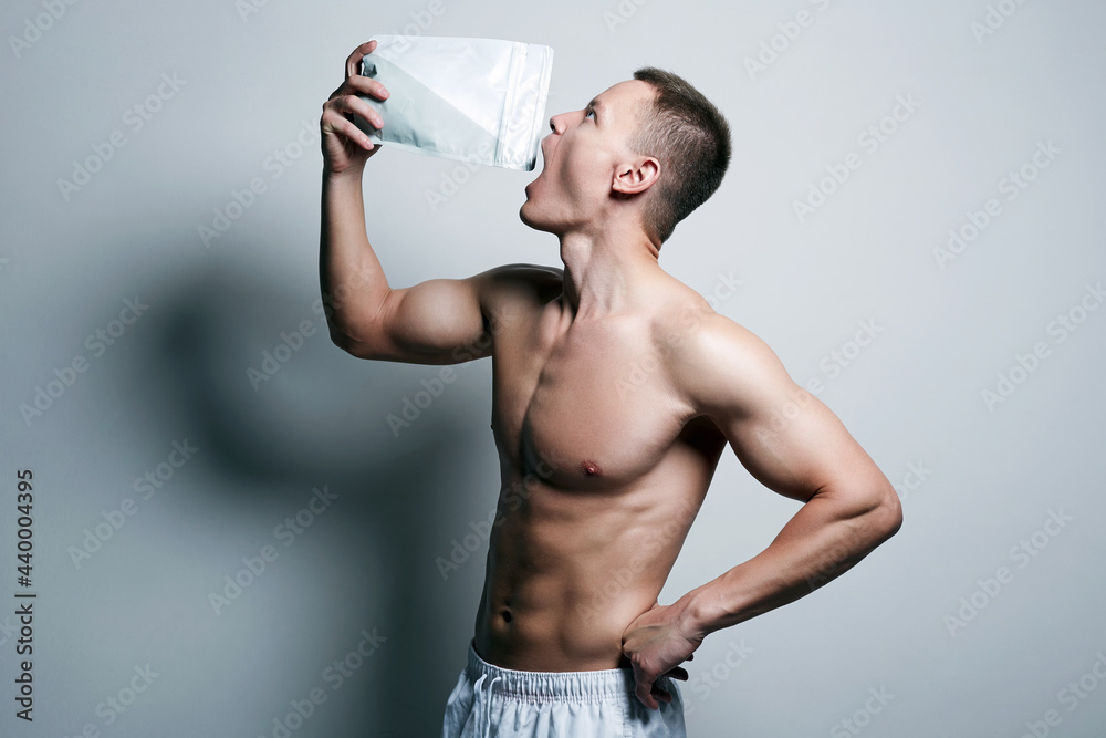 bodybuilder eating sports nutrition. Sport body muscular Man Stock ...