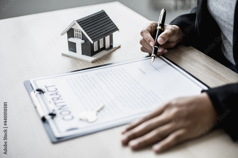 The salesperson is checking the contract before making an appointment ...