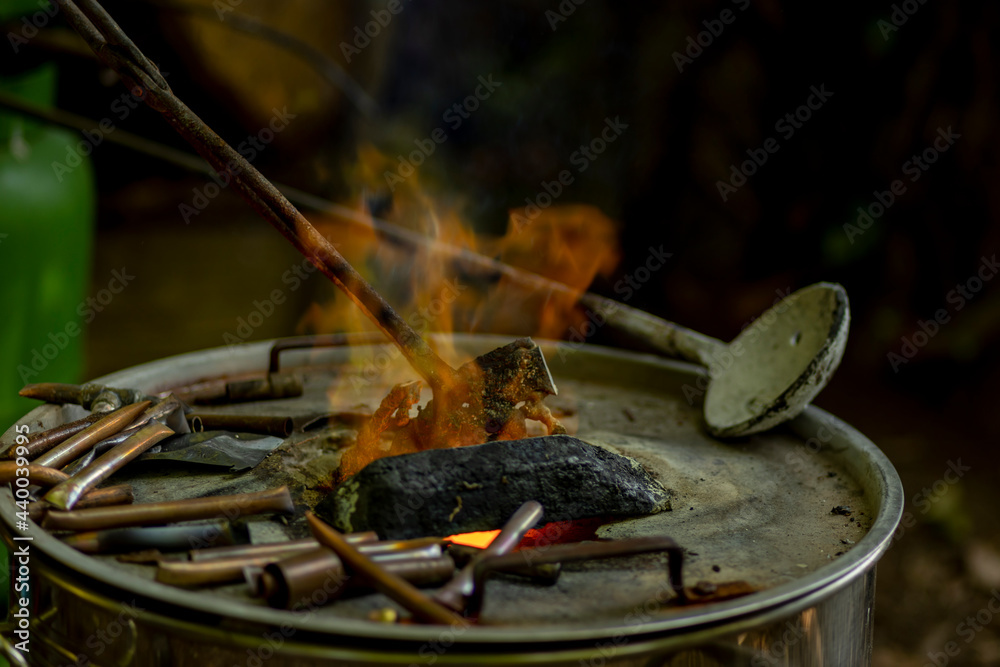 Flaming orange and red tones of super heated mix of metals tin and ...