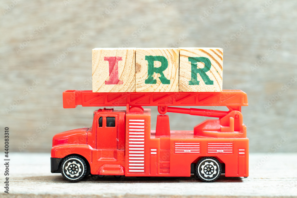 Fire ladder truck hold letter block in word IRR (Abbreviation of ...