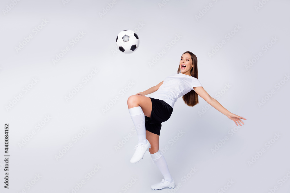 Full body photo of excited lady player soccer team kick leg control ...