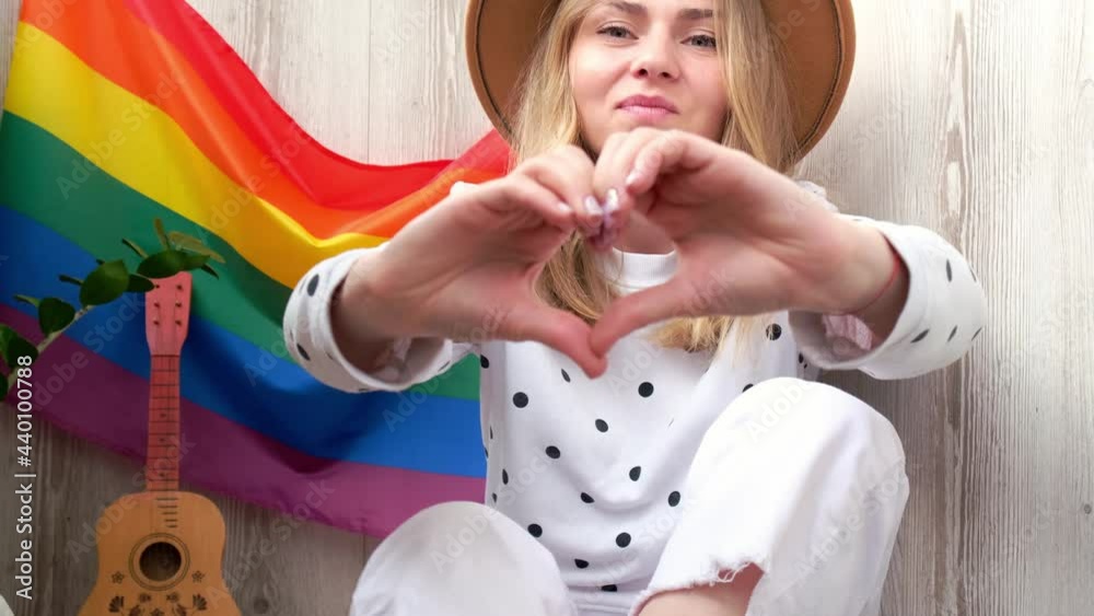 4k Young blonde millennial hippie woman showing heart sign with hands ...