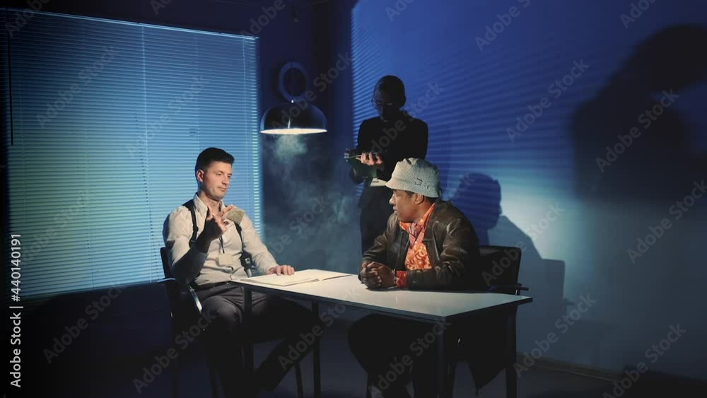 Interrogation room in smoke: detective showing evidence of drug ...