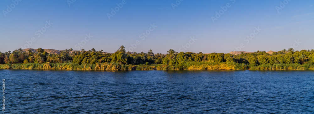 Horizontal panorama view of the shores of the Nile River in southern ...