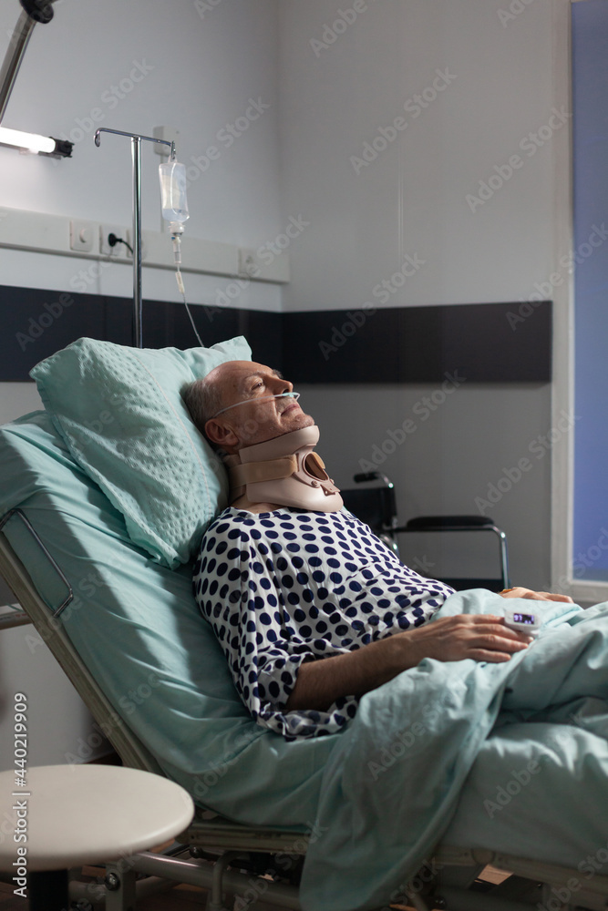 Senior man suffering after serious accident laying in hospital bed ...