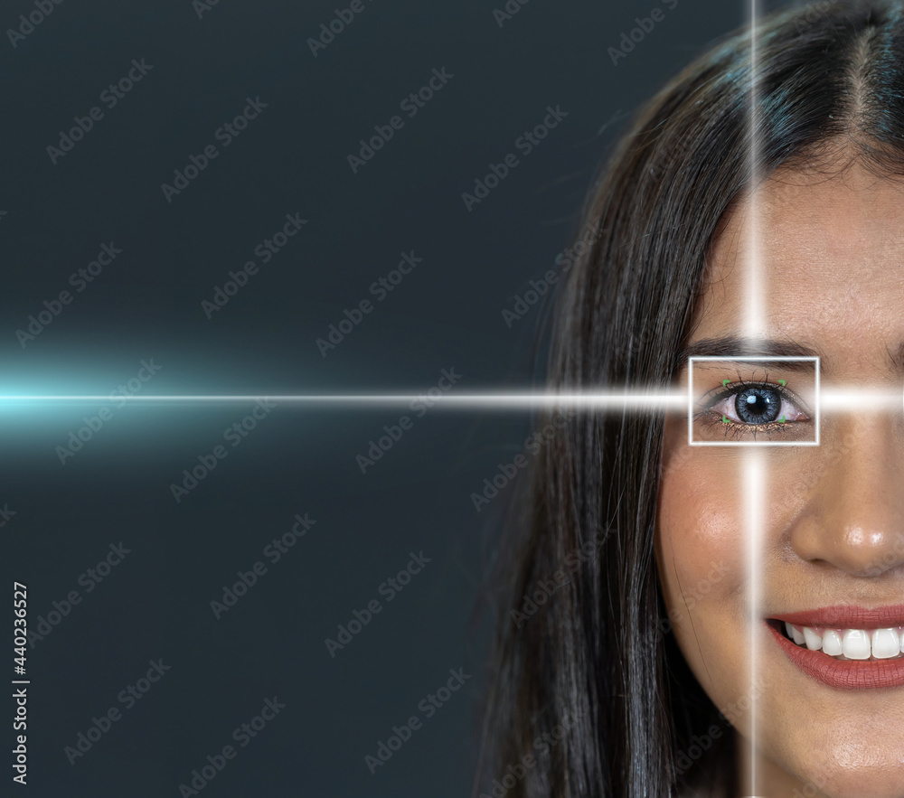 Eye scanning of asian young woman by laser light over the dark ...