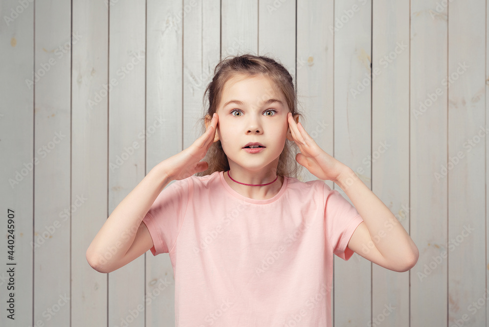Terrified little girl having anxious stressed out look, holding hands ...