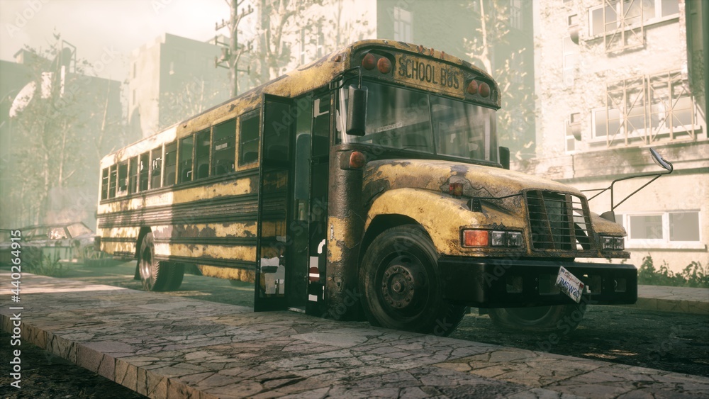 An old abandoned rusty school bus stands in the middle of the road in a ...