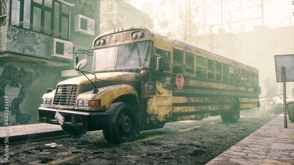 An old abandoned rusty school bus stands in the middle of the road in a ...
