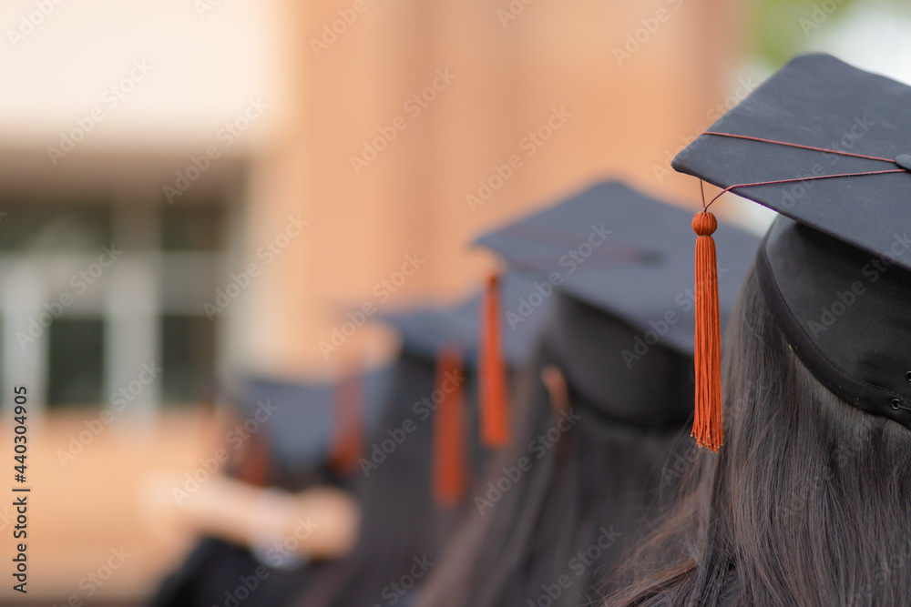 Graduation cap image from the back of graduates Graduates attending the ...