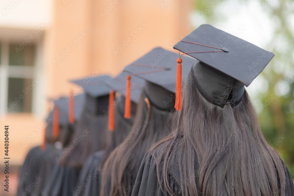 Graduation cap image from the back of graduates Graduates attending the ...