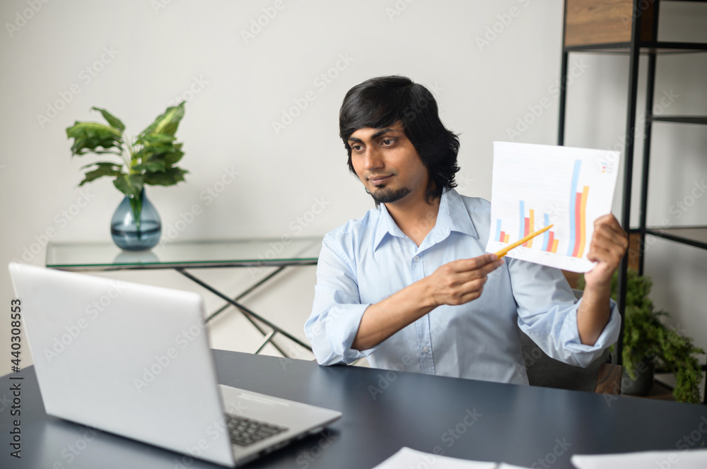 Confident indian businessman, teacher or tutor holding and ...