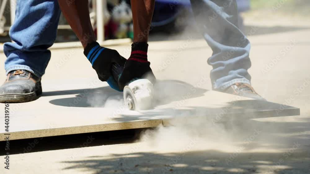 Construction Site, Worker metal construction in gloves using angle ...
