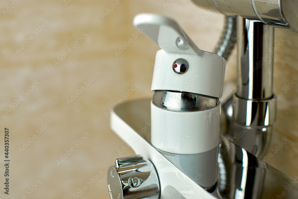 Dirty water tap in the bathroom. Shower faucet with lime coating, close ...