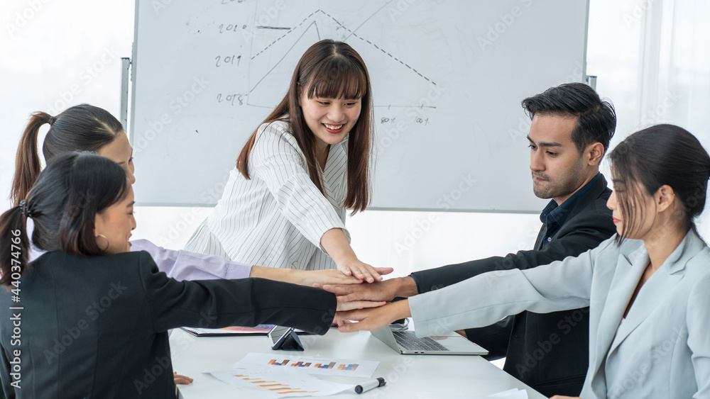 The group of employees join hand together the best teamwork ...