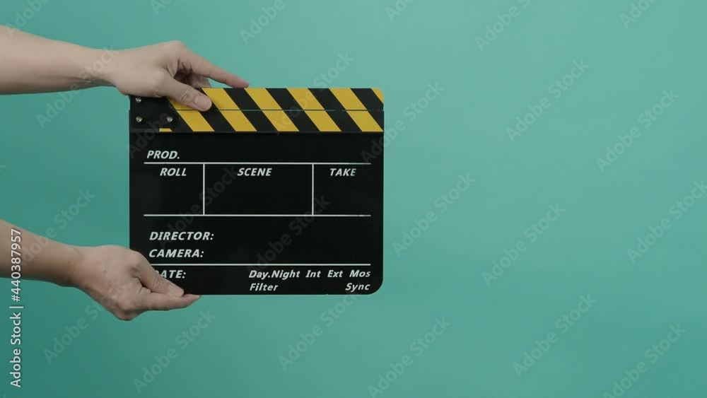 Vidéo Stock Film Slate or Movie Clapperboard with Blue Green screen ...