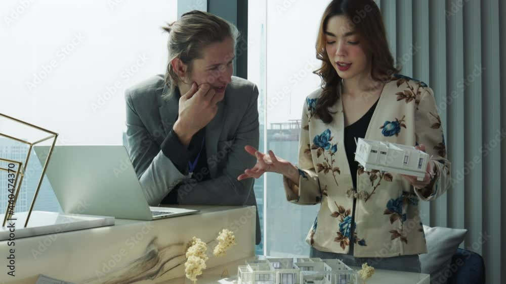 Young Asian Interior and caucasian Architect working with architectural ...