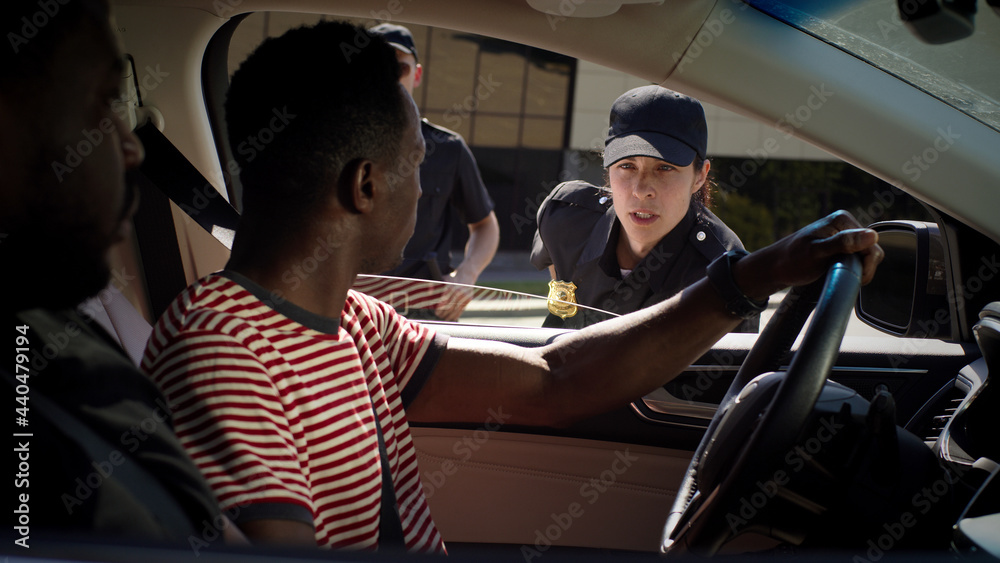 Black men discussing police officer in vehicle Stock Photo | Adobe Stock